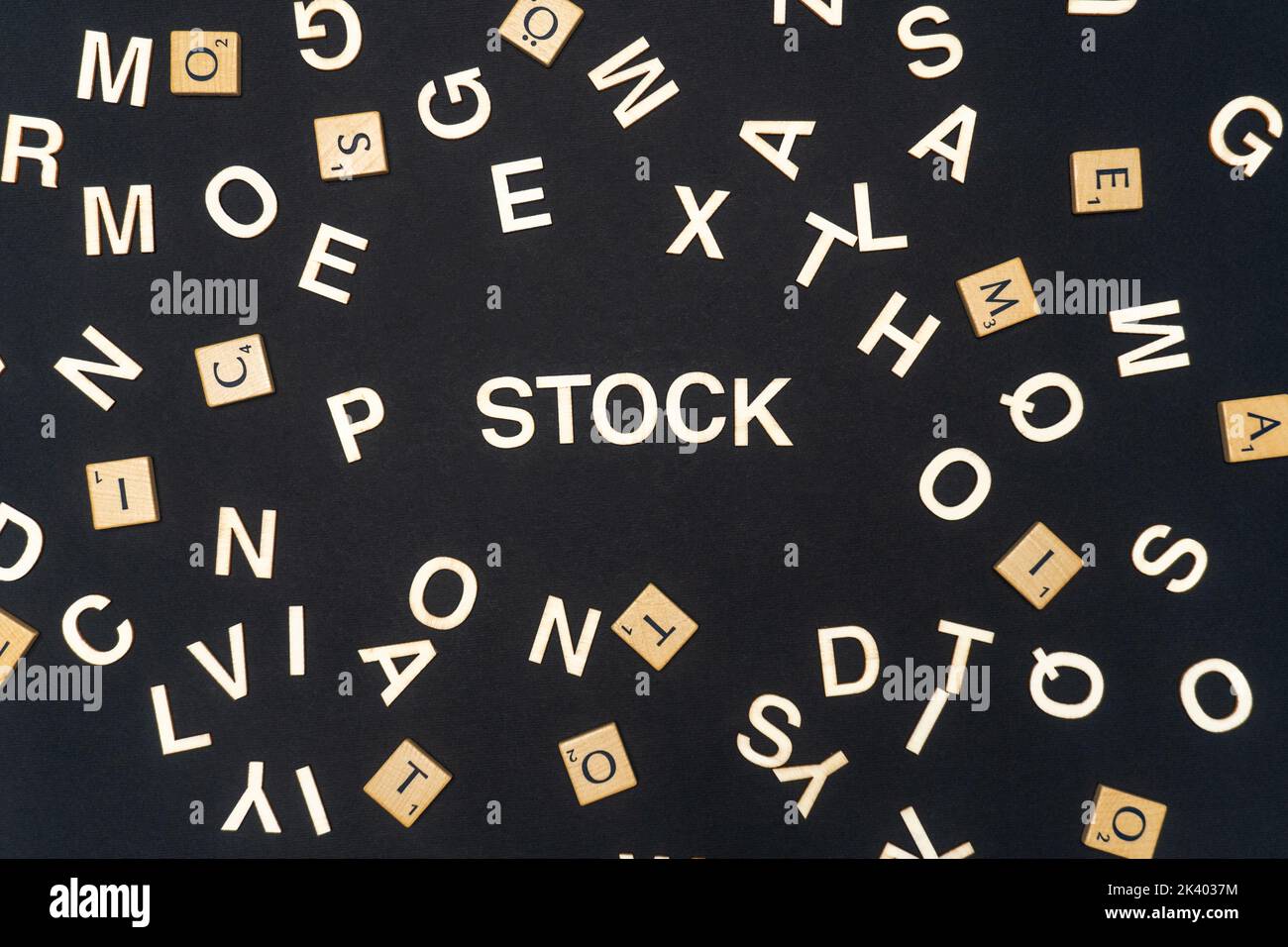 STOCK word written on dark paper background. STOCK text on dark for ...