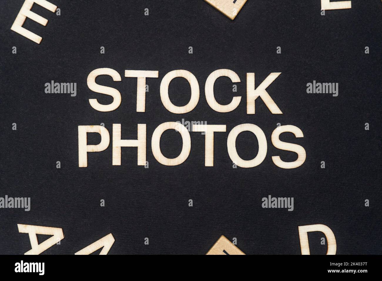 STOCK PHOTOS word written on dark paper background. STOCK PHOTOS text ...