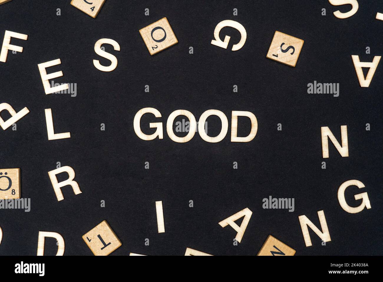 GOOD word written on dark paper background. GOOD text on dark for your ...