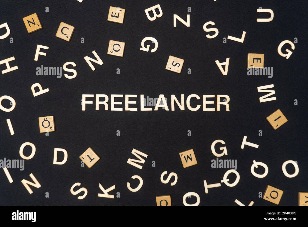 FREELANCER word written on dark paper background. FREELANCER text on ...