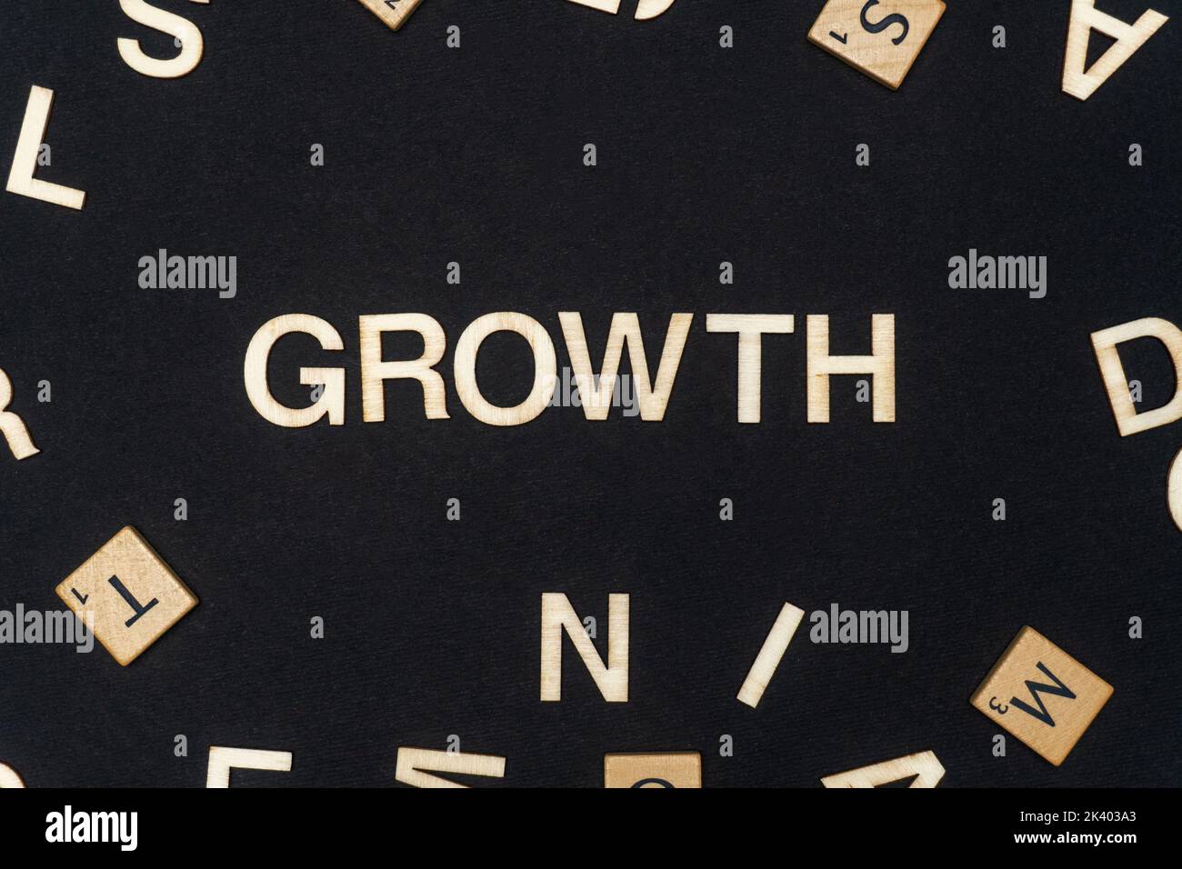 GROWTH word written on dark paper background. GROWTH text on dark for ...