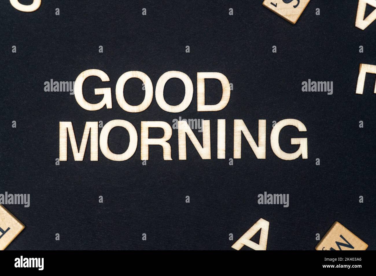 GOOD MORNING word written on dark paper background. GOOD MORNING text ...