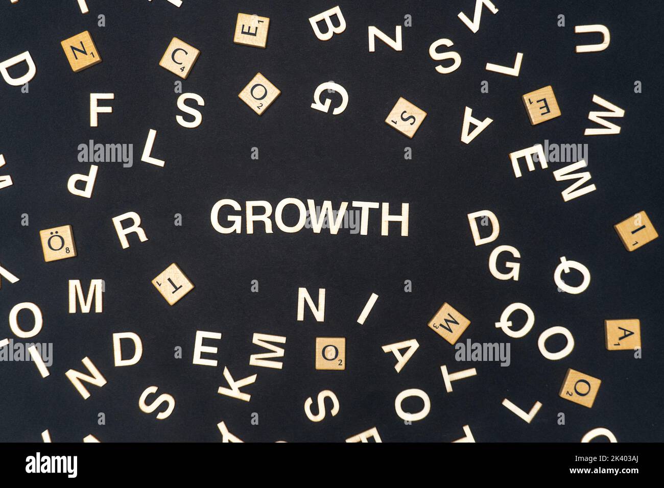 GROWTH word written on dark paper background. GROWTH text on dark for ...