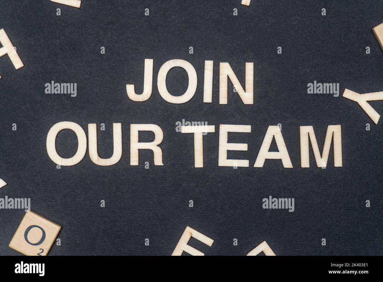 JOIN OUR TEAM word written on dark paper background. JOIN OUR TEAM text ...