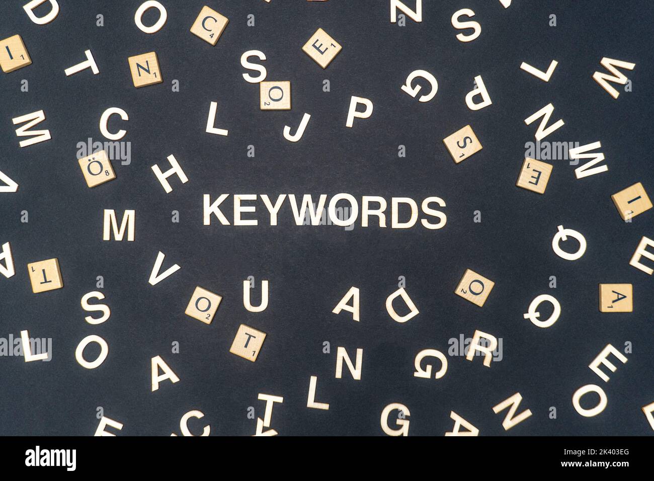 KEYWORDS word written on dark paper background. KEYWORDS text on dark ...