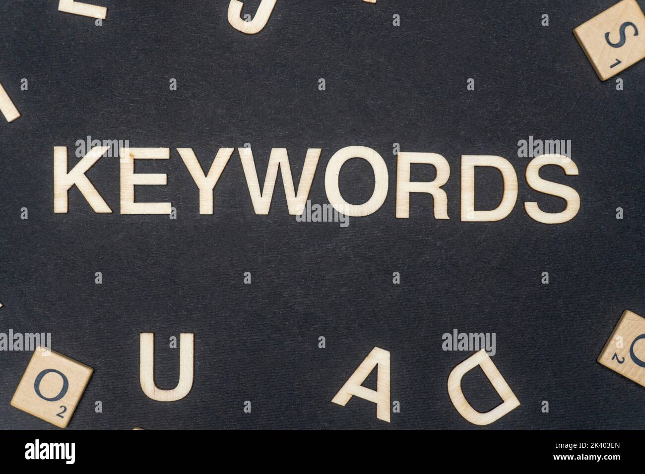 KEYWORDS word written on dark paper background. KEYWORDS text on dark ...
