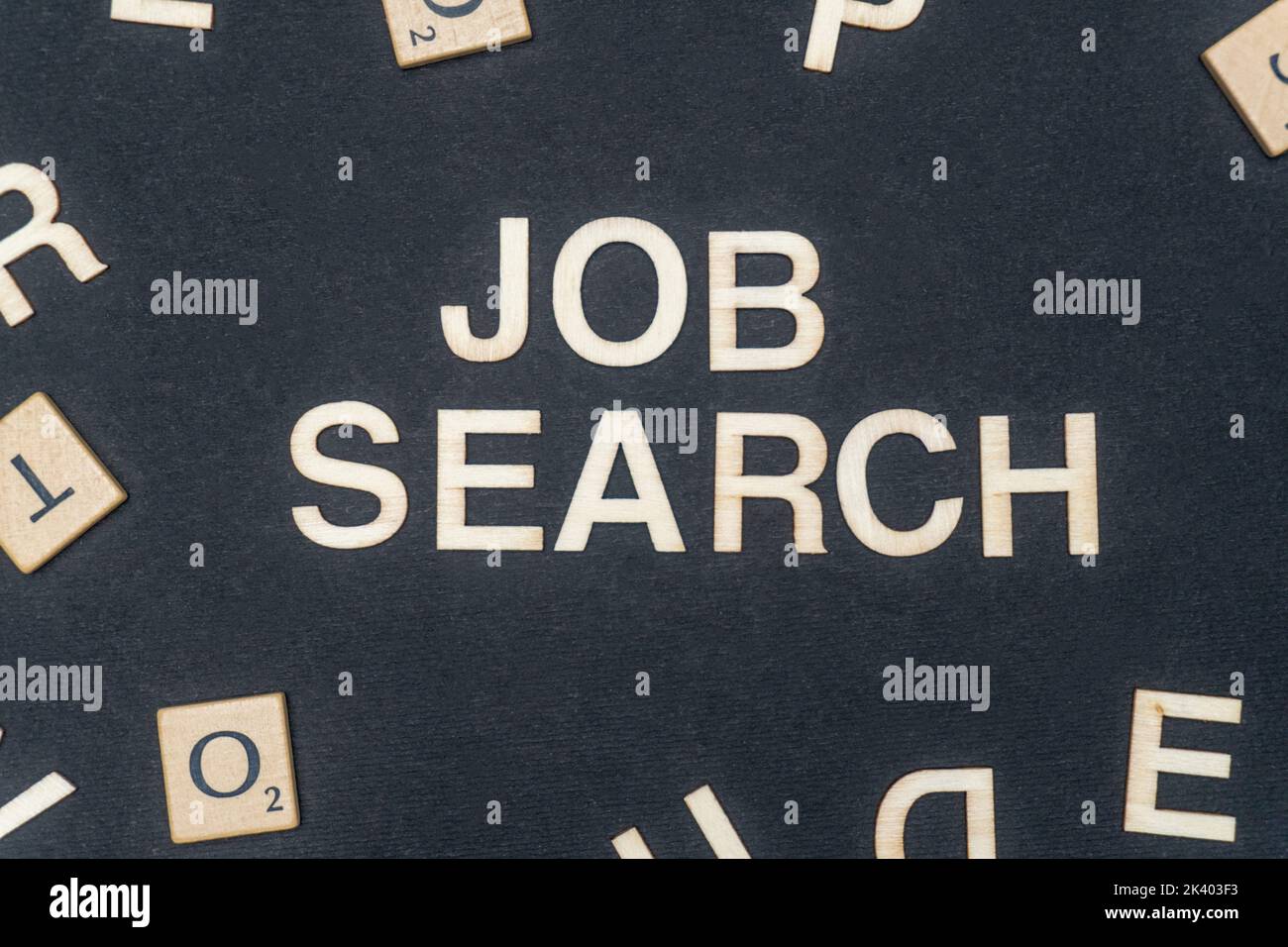 JOB SEARCH word written on dark paper background. JOB SEARCH text on ...