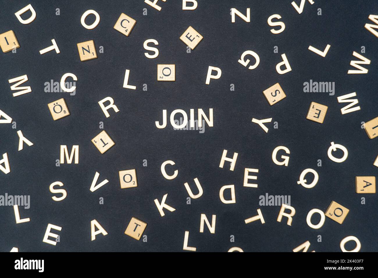 JOIN word written on dark paper background. JOIN text on dark for your ...