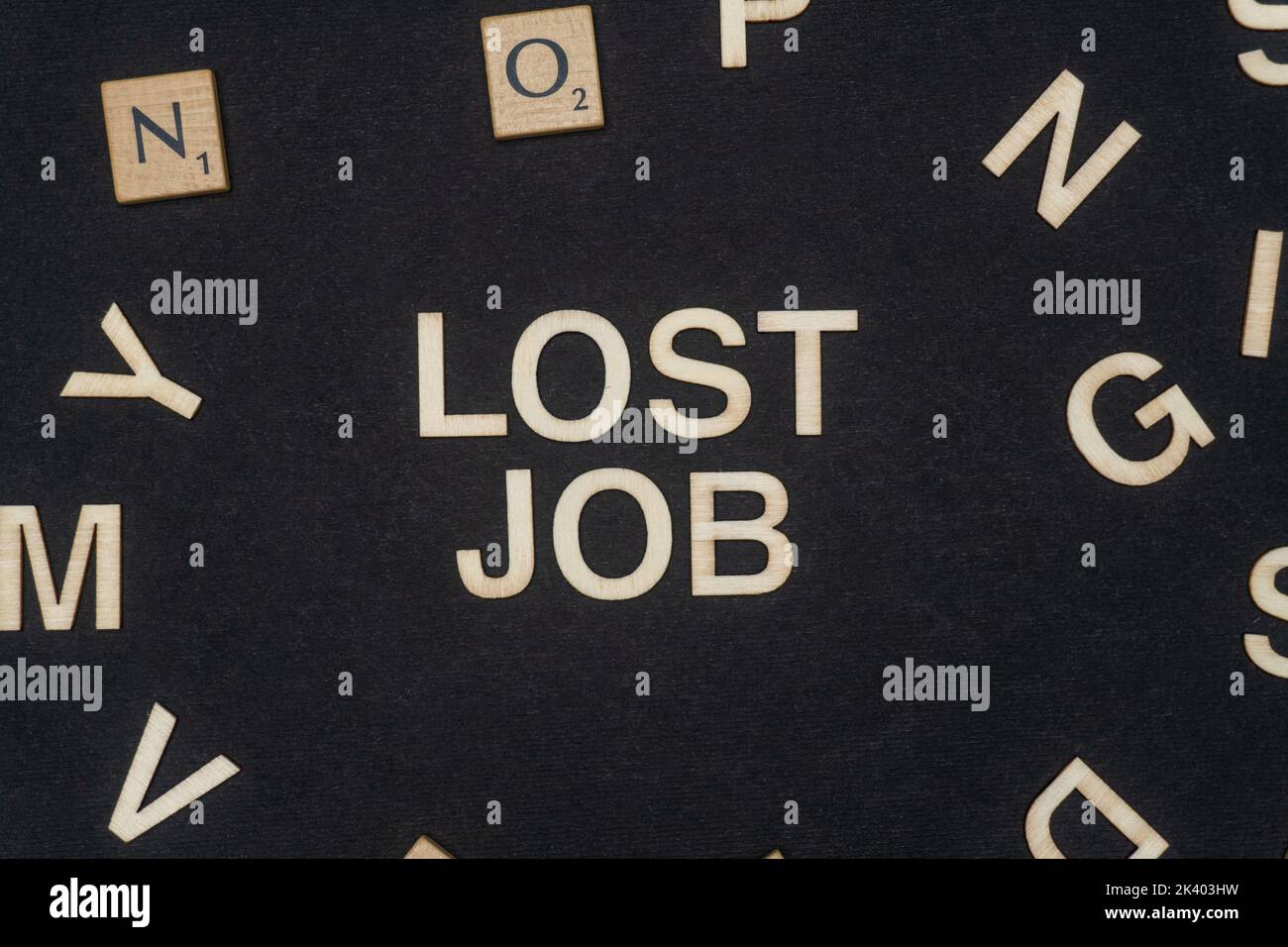 LOST JOB word written on dark paper background. LOST JOB text on dark ...
