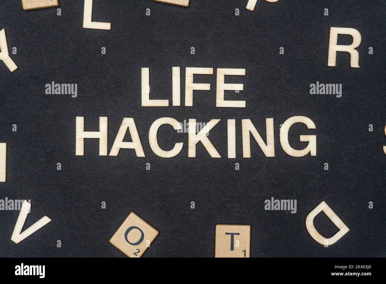 LIFE HACKING word written on dark paper background. LIFE HACKING text ...