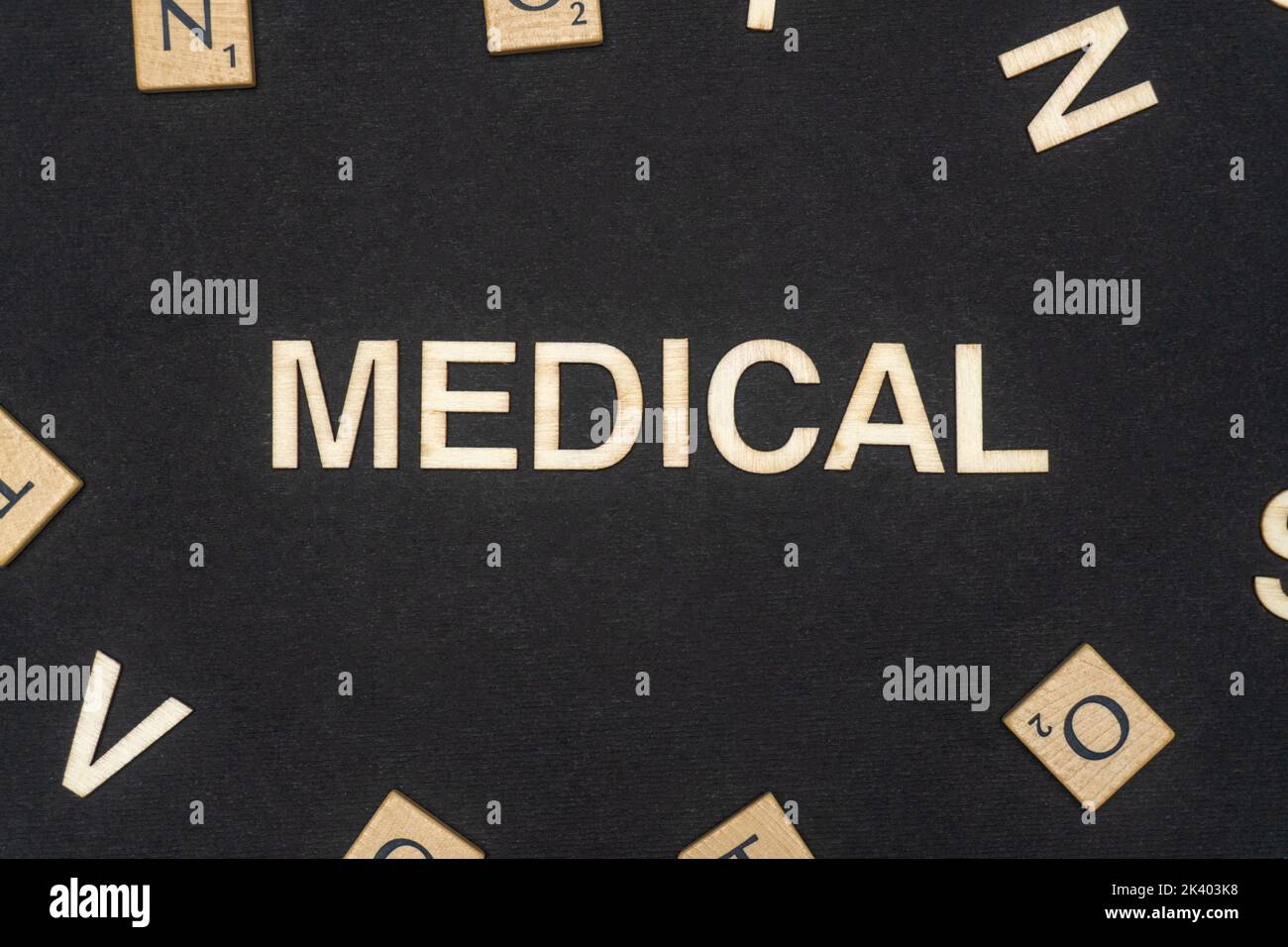MEDICAL word written on dark paper background. MEDICAL text on dark for ...
