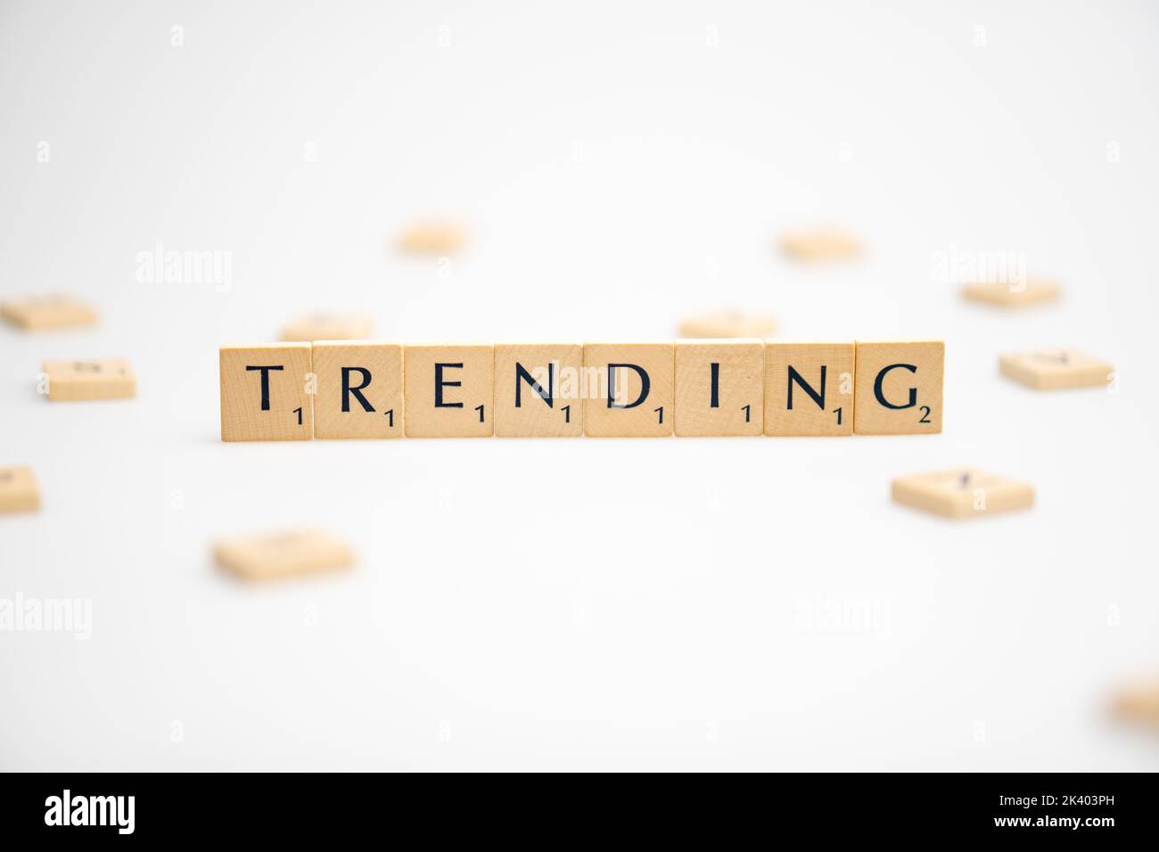 TRENDING word written on white background. TRENDING text on white for ...