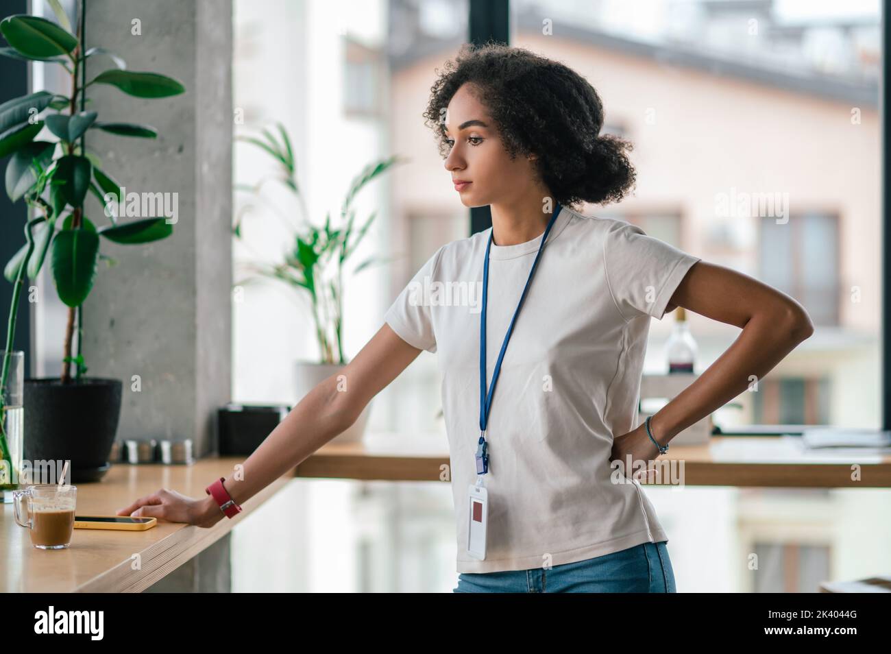 Young pretty office worker in the office canteen Stock Photo - Alamy