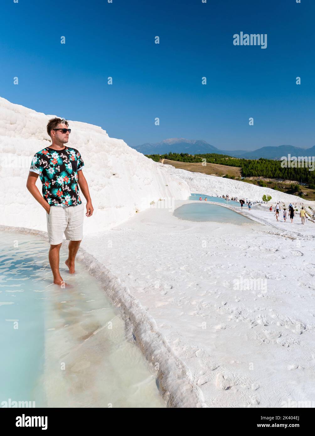Natural travertine pools and terraces in Pamukkale. Cotton castle in ...