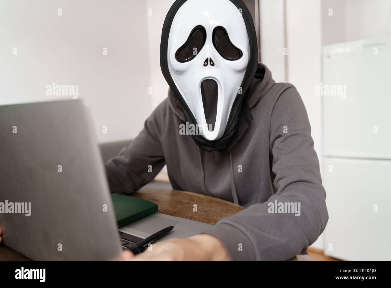 Person in anonymous mask working hi-res stock photography and images ...