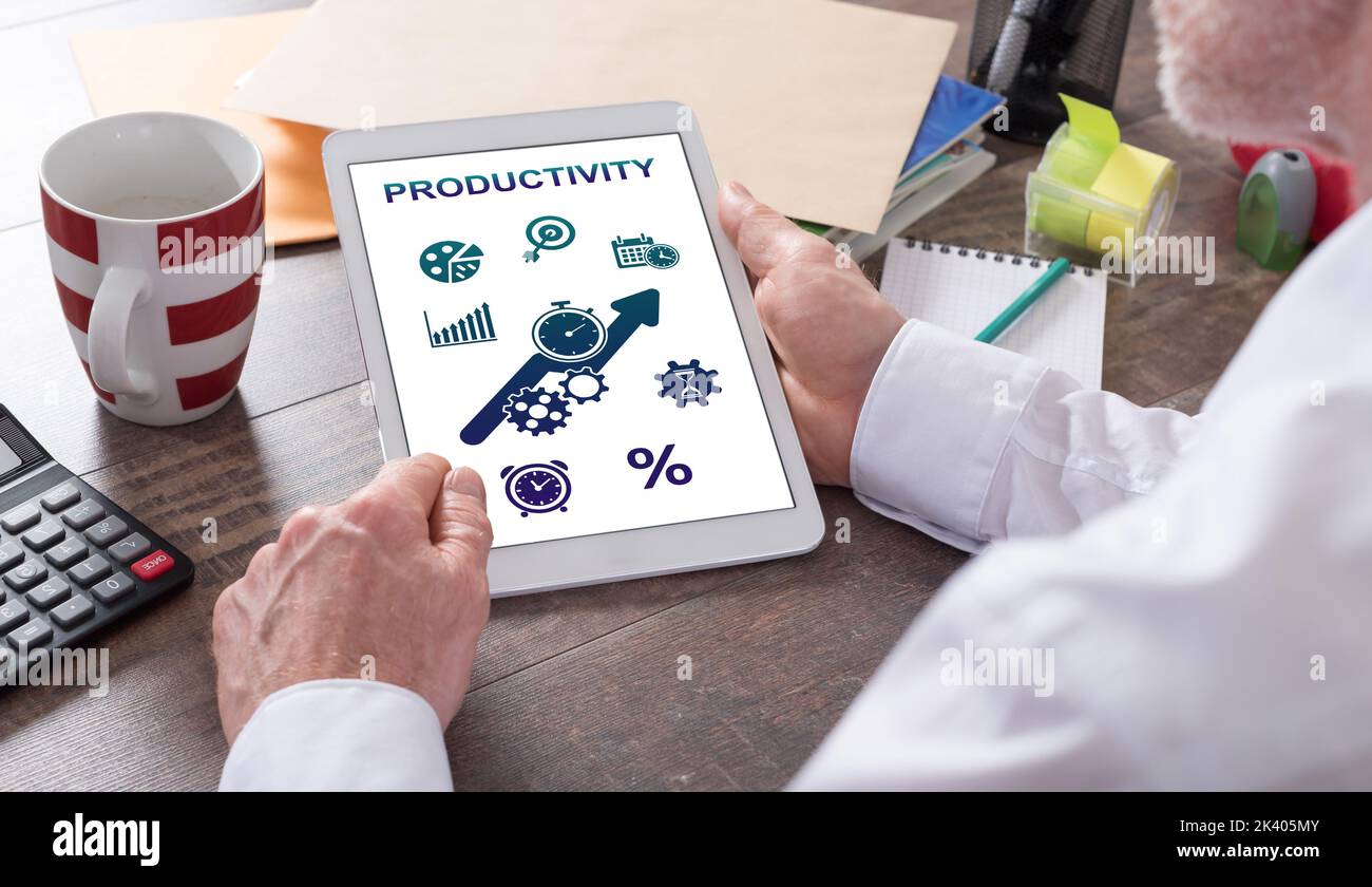 Productivity concept shown on a tablet held by a man Stock Photo - Alamy