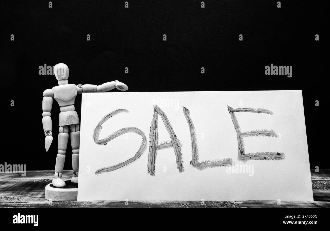 Sale. Wooden dummy and sale handwritten. Advertising sign ...