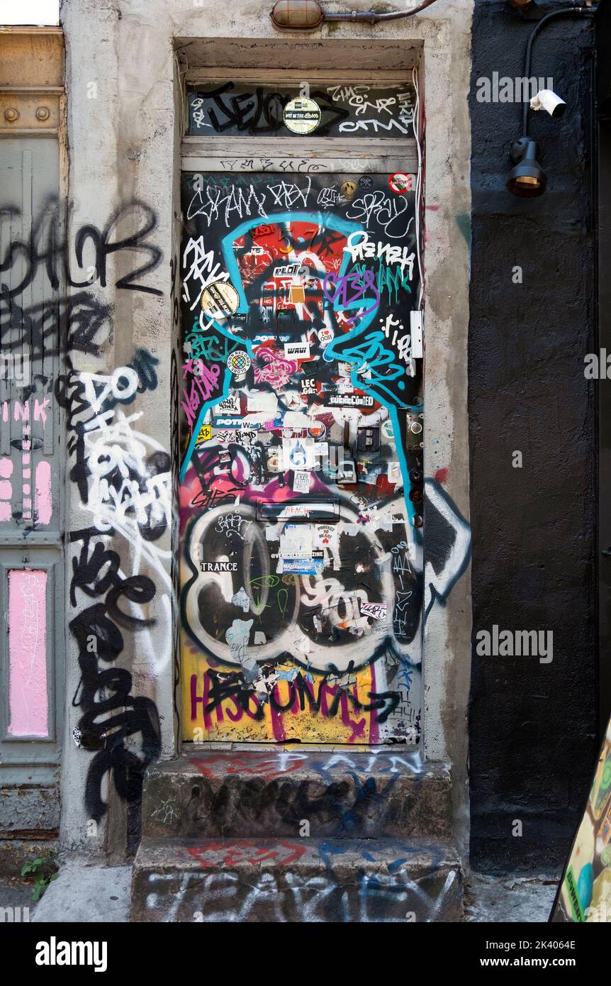A doorway on the Lower East Side completely covered with graffiti ...