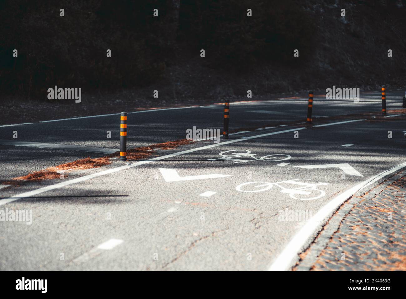 View with a shallow depth of field of a modern suburban road in a park ...