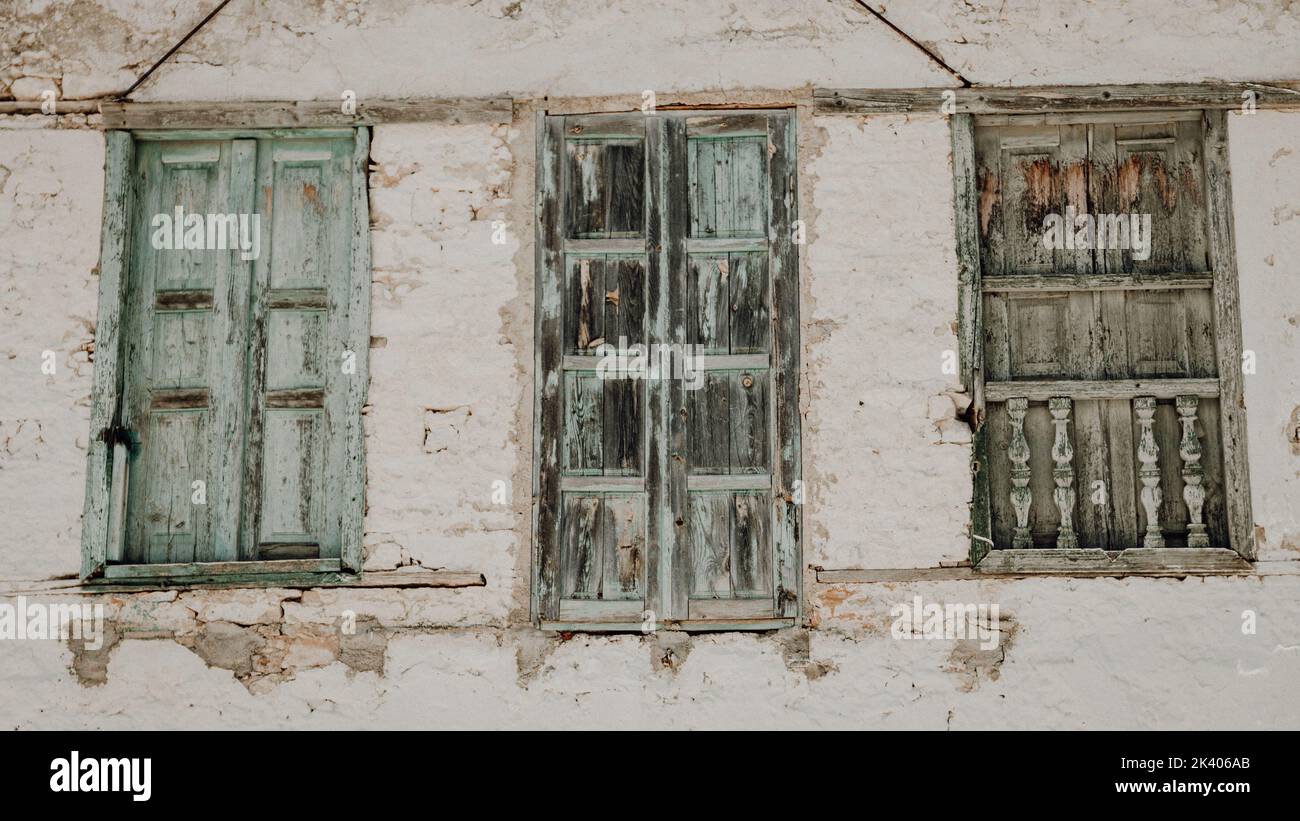old Greek shutter window at a Greek village. Holiday vacation concept ...
