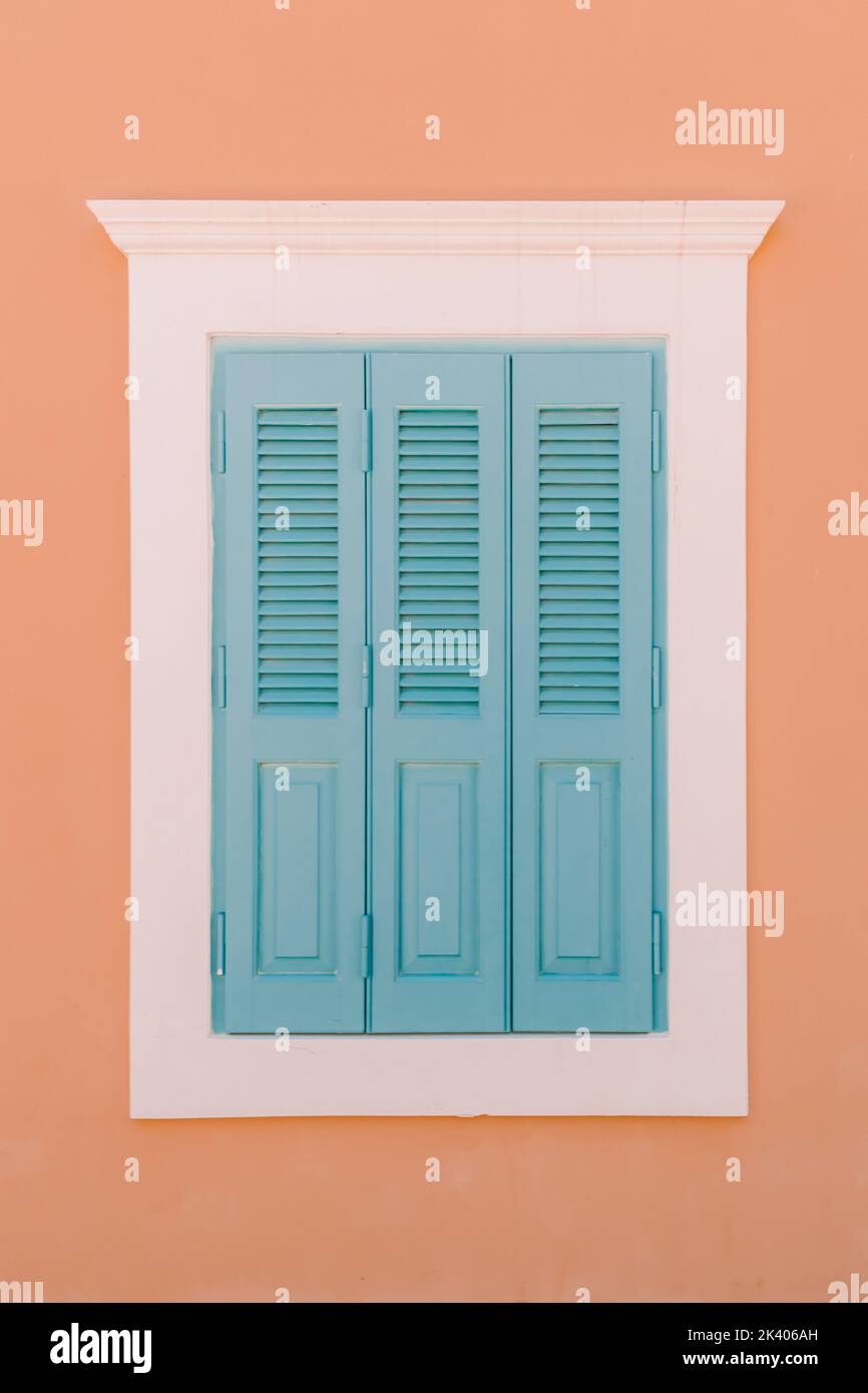 old Greek shutter window at a Greek village. Holiday vacation concept ...