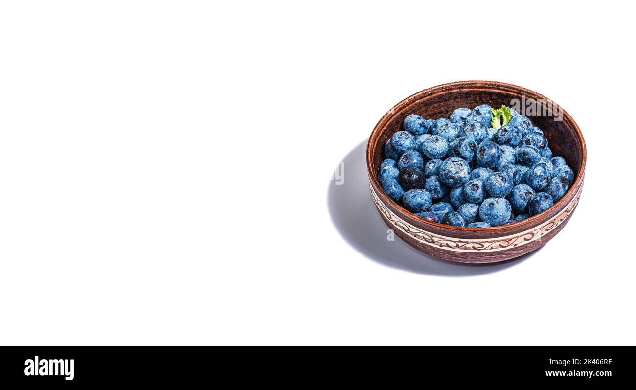 Bowl of ripe blueberries isolated on white background. Fresh fruits ...