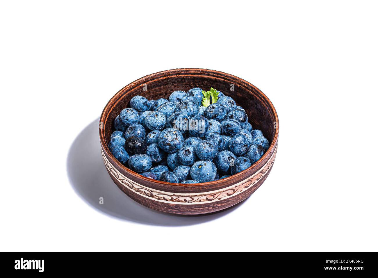 Bowl of ripe blueberries isolated on white background. Fresh fruits ...