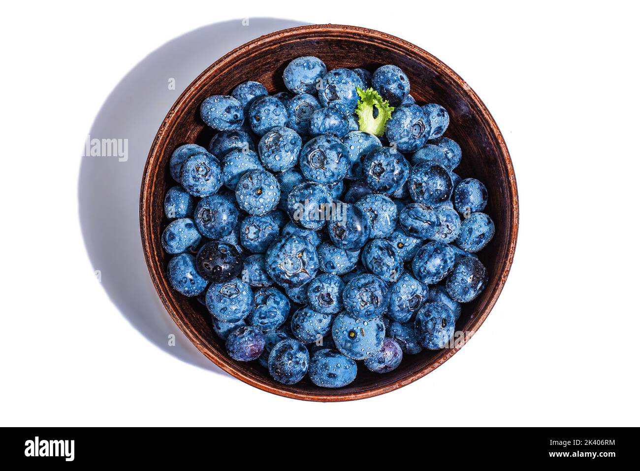 Bowl of ripe blueberries isolated on white background. Fresh fruits ...