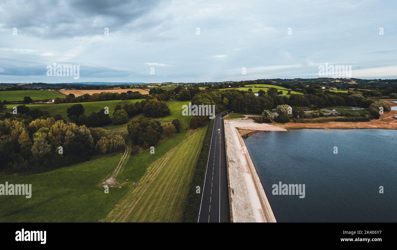 Aerial view from road between lake and land Stock Photo - Alamy