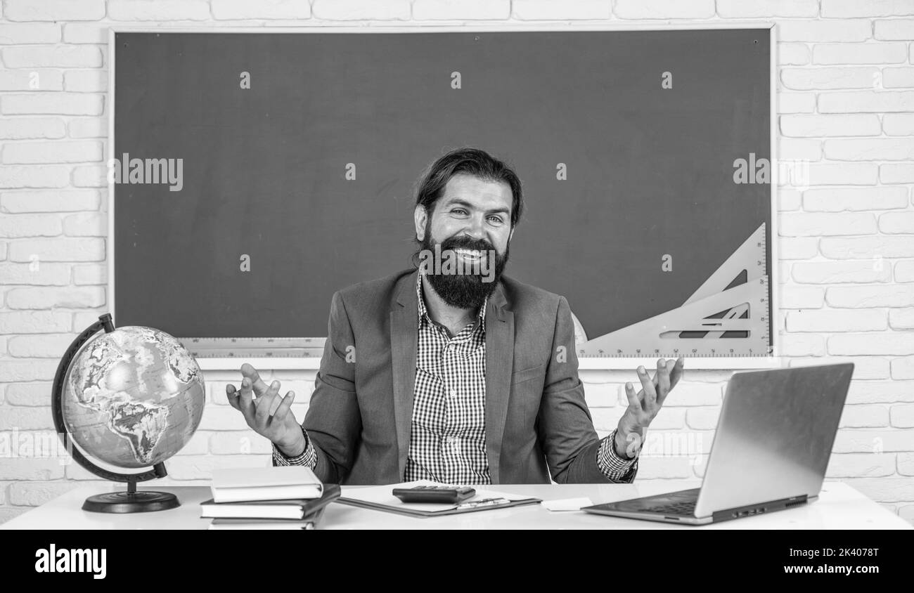 nice smile. informal education. male student sit in classroom while ...