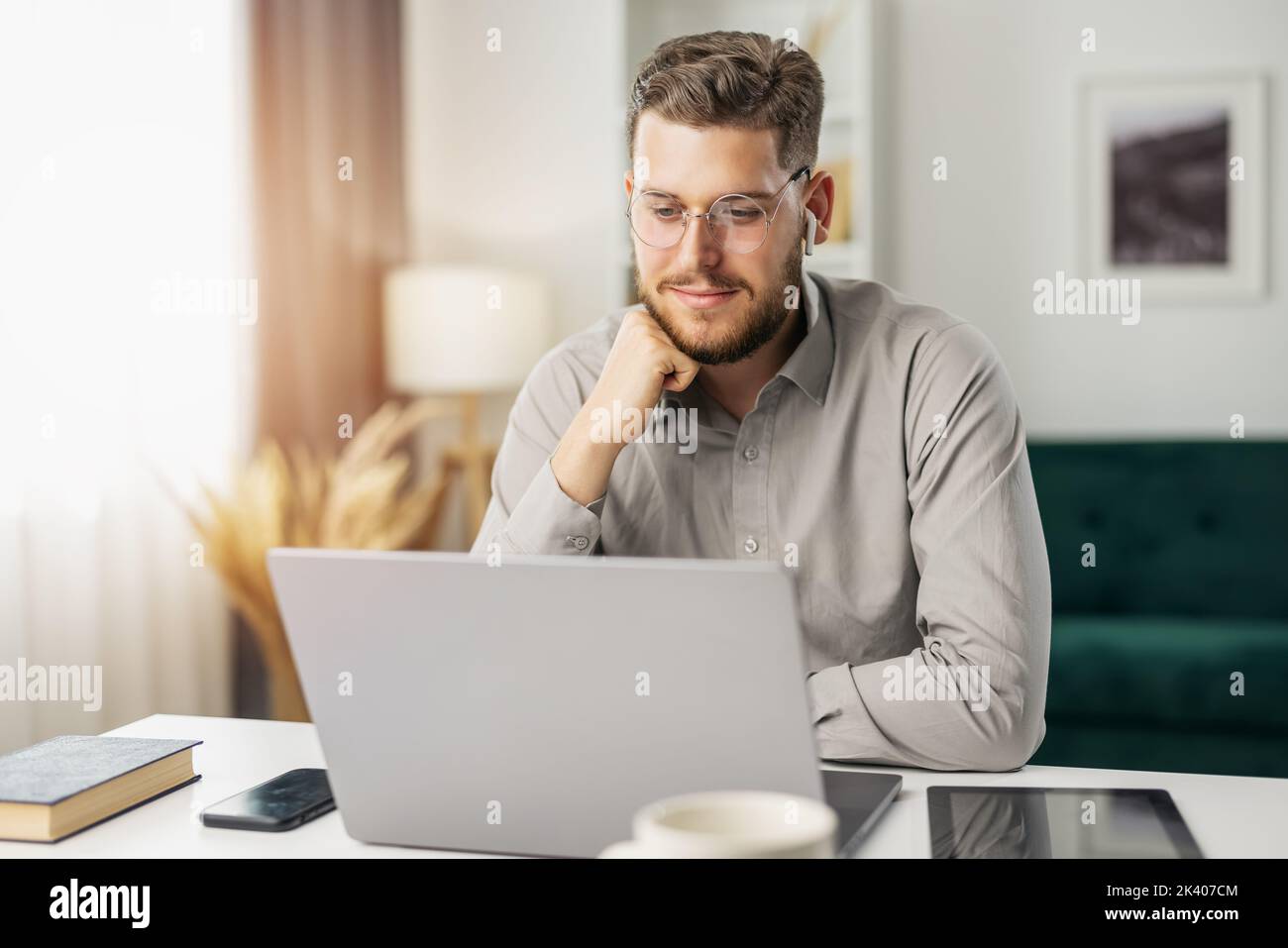 Happy Young Coder Working With Laptop From Home Handsome Man Coding Using Gadgets And Computer