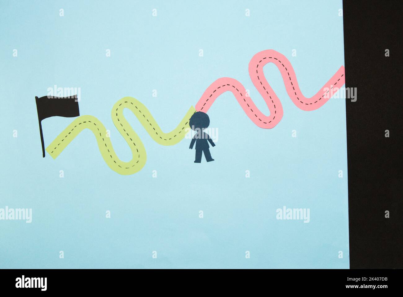 paper man at the crossroads, one path leads to the goal, the other ...