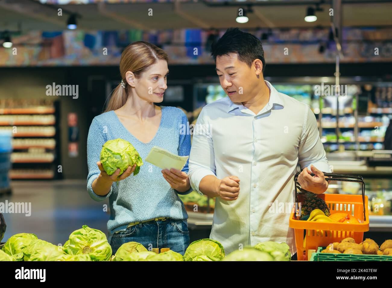 Family shopping. Young international couple shopping together in a ...
