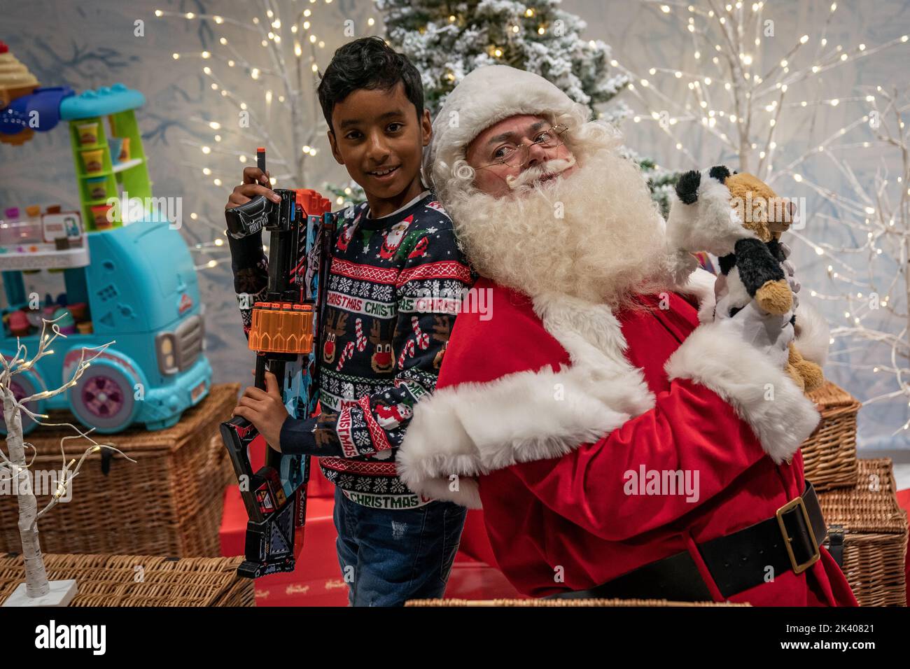 Adam Baba, 9, and a man dressed as Santa Claus. As children attend the ...