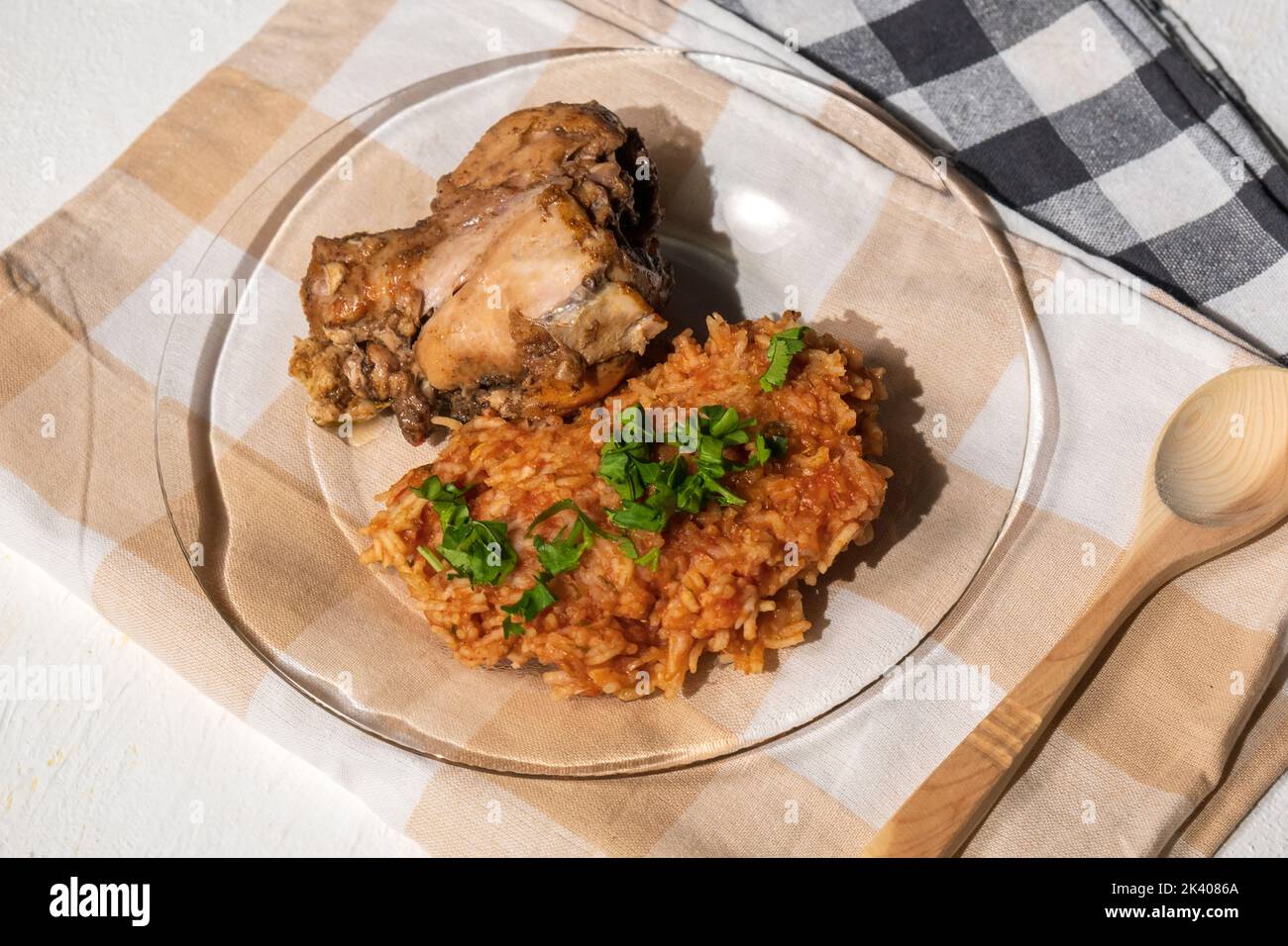 Nigerian food: Jollof rice with fried chicken close-up on a plate Stock ...