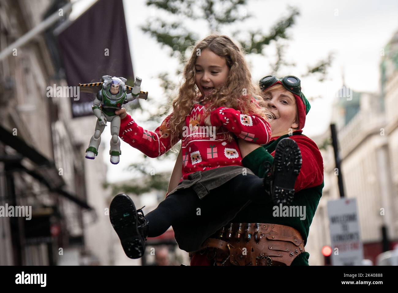 River Jolly, 7, plays with a Buzz Light Year Jet Pack toy. As children ...