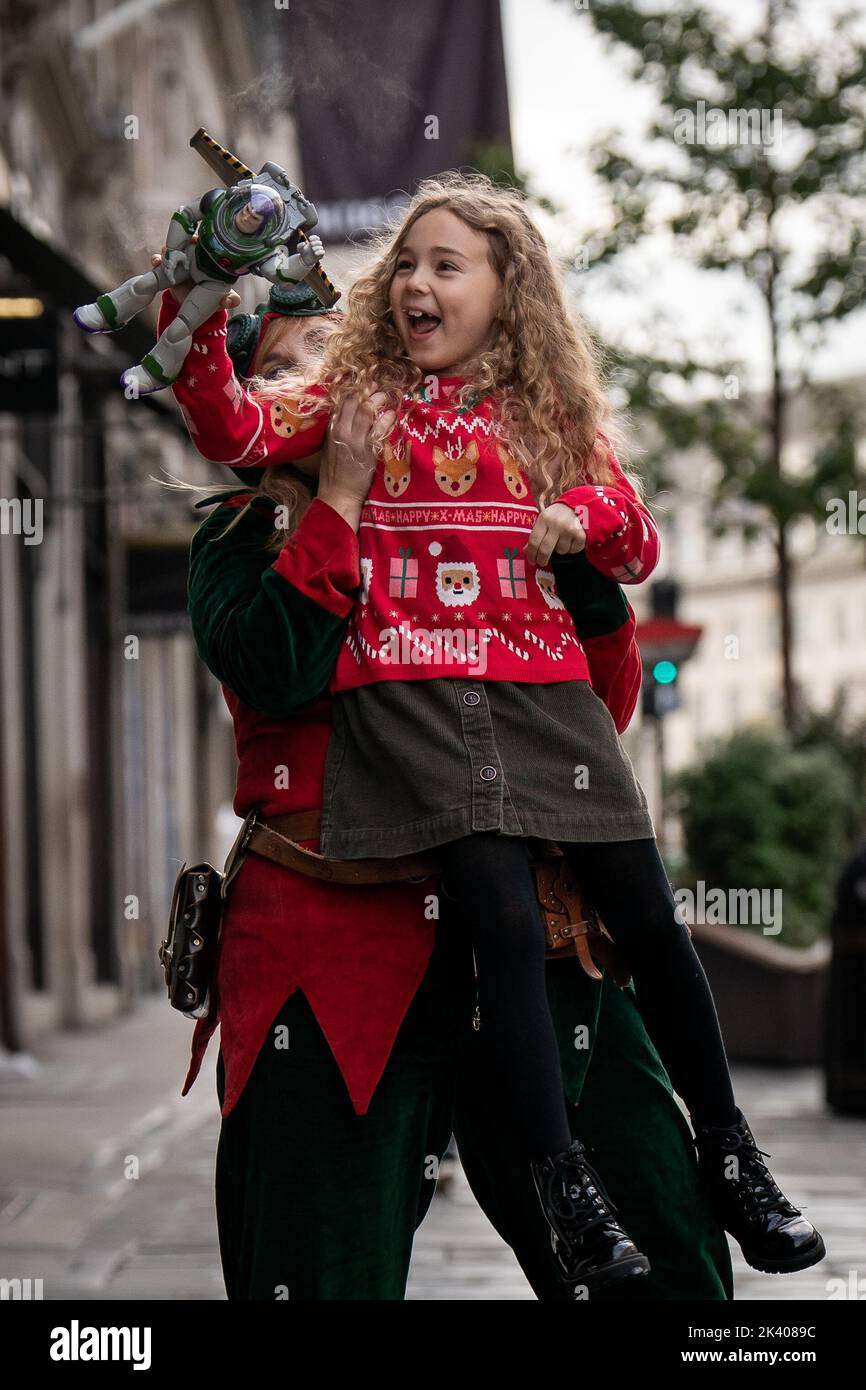 River Jolly, 7, plays with a Buzz Light Year Jet Pack toy. As children ...