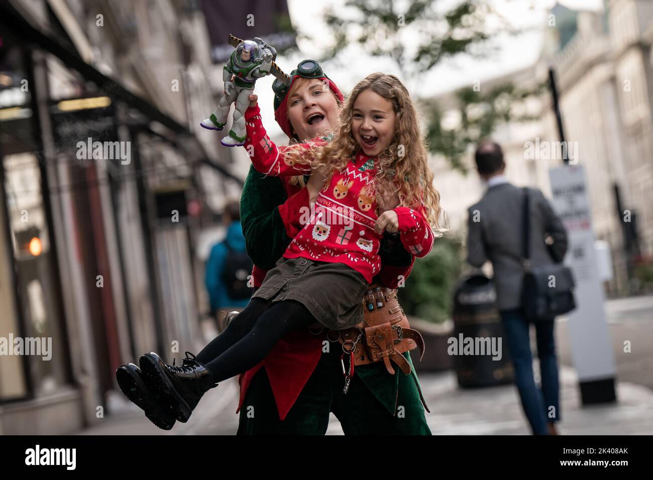 River Jolly, 7, plays with a Buzz Light Year Jet Pack toy. As children ...
