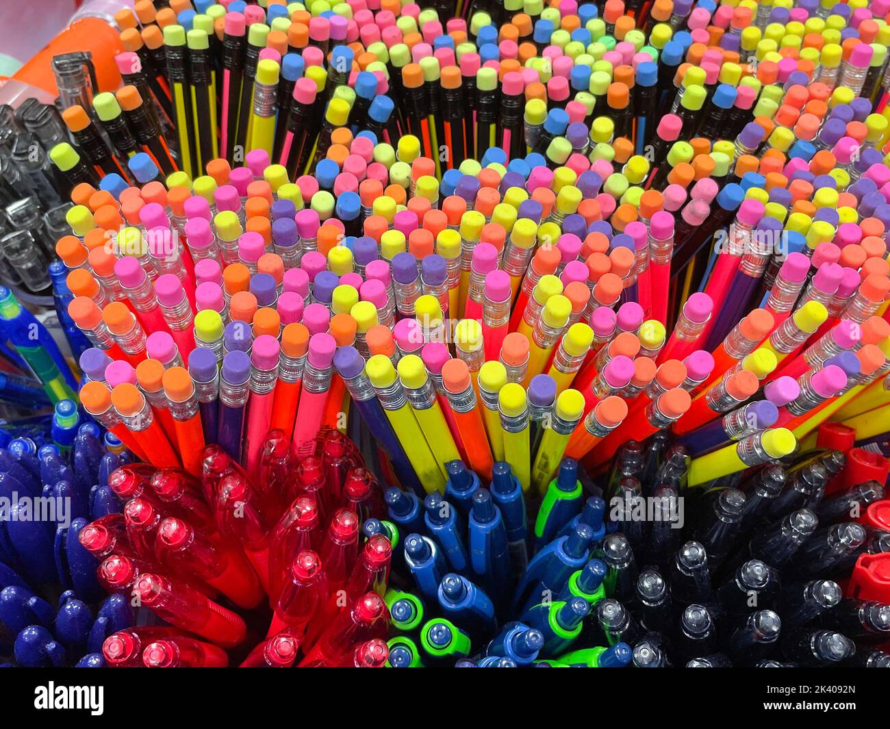 Pile of pens and pencils of different colours. Background texture ...