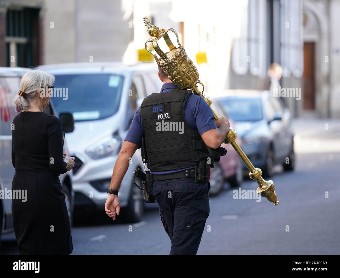 A police officer carries the Mace of Lord Chancellor before the arrival of Justice Secretary ...