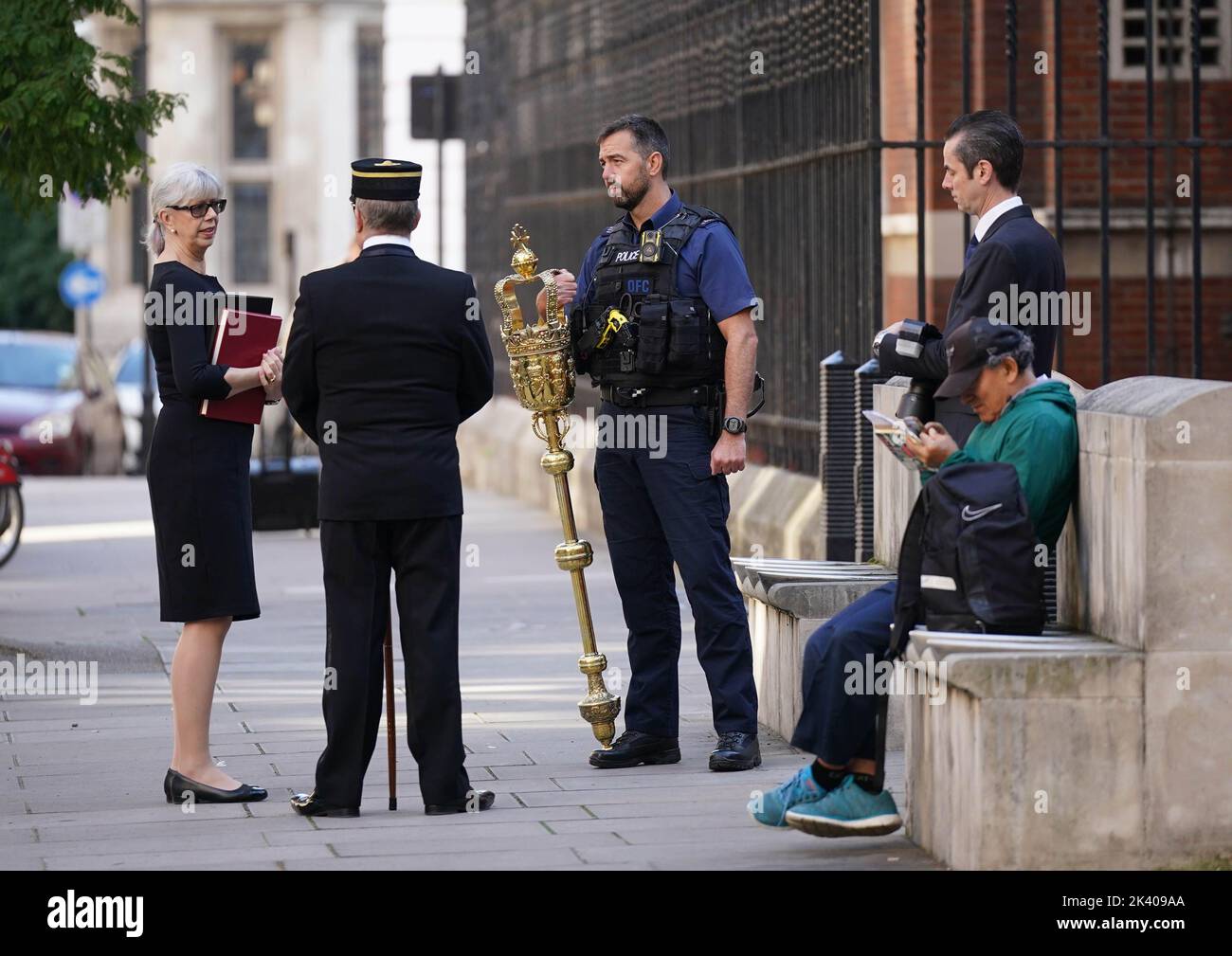 A police officer carries the Mace of Lord Chancellor before the arrival of Justice Secretary ...