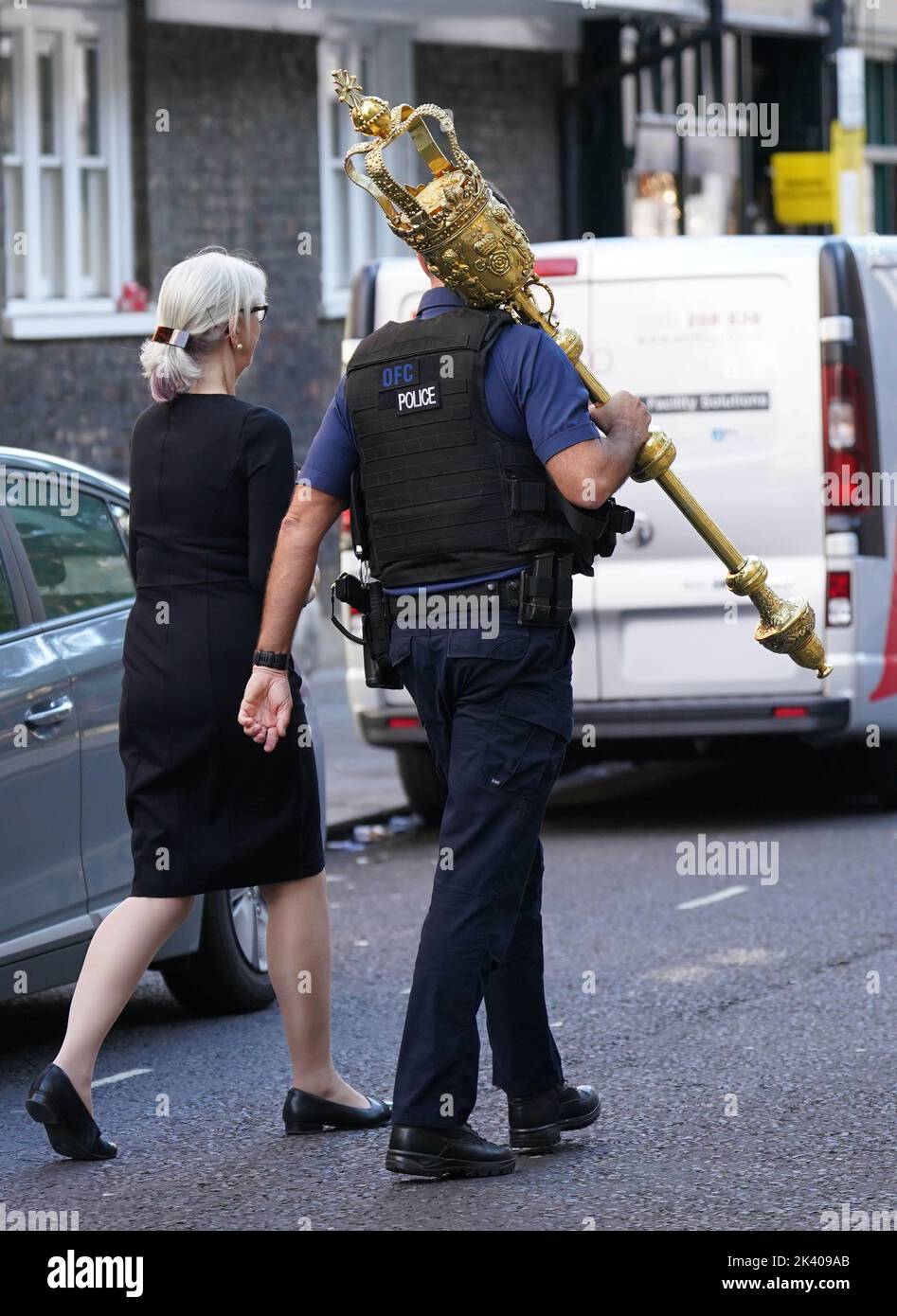 A police officer carries the Mace of Lord Chancellor before the arrival of Justice Secretary ...