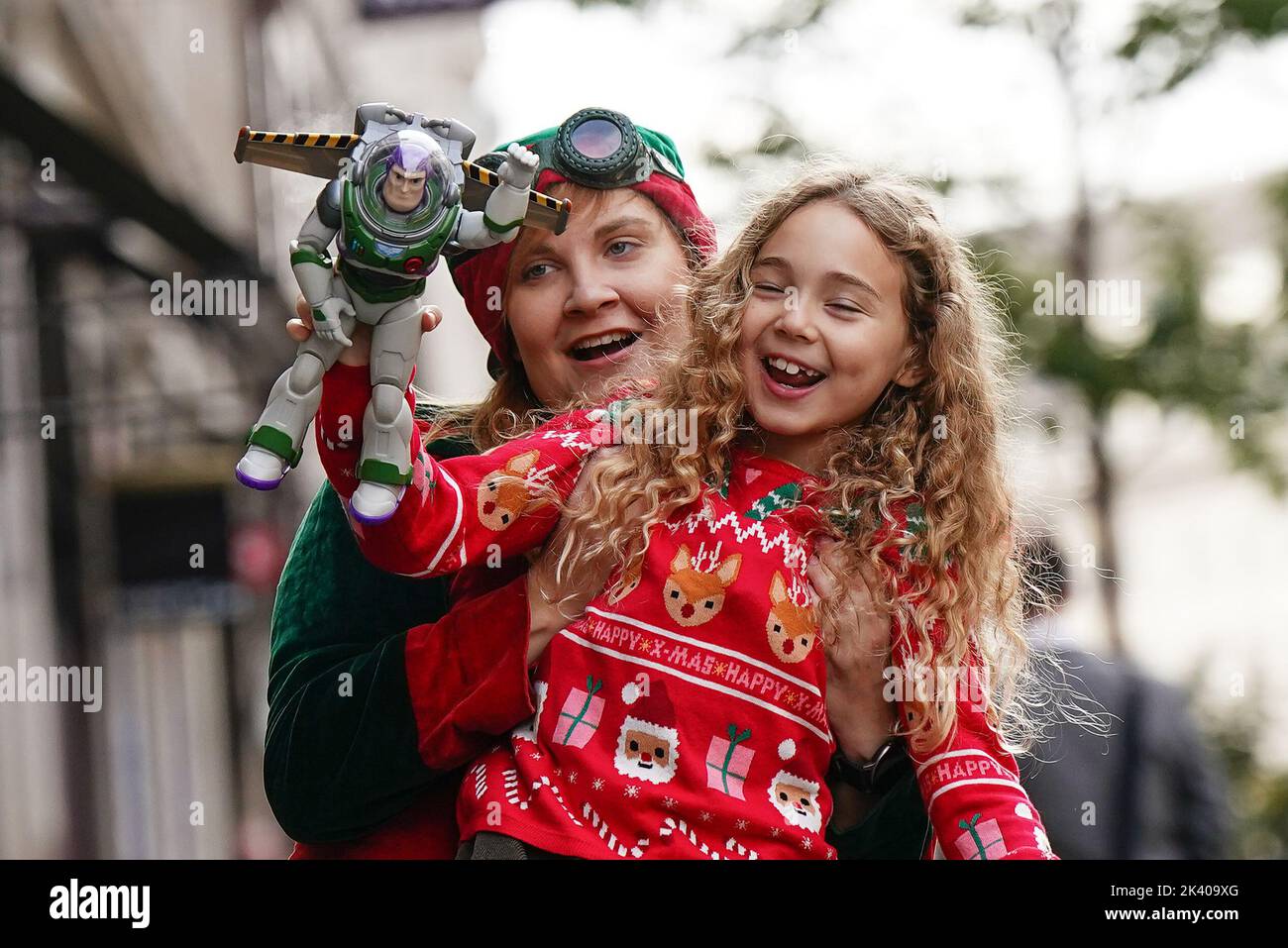 River Jolly, 7, plays with a Buzz Light Year Jet Pack toy. As children ...