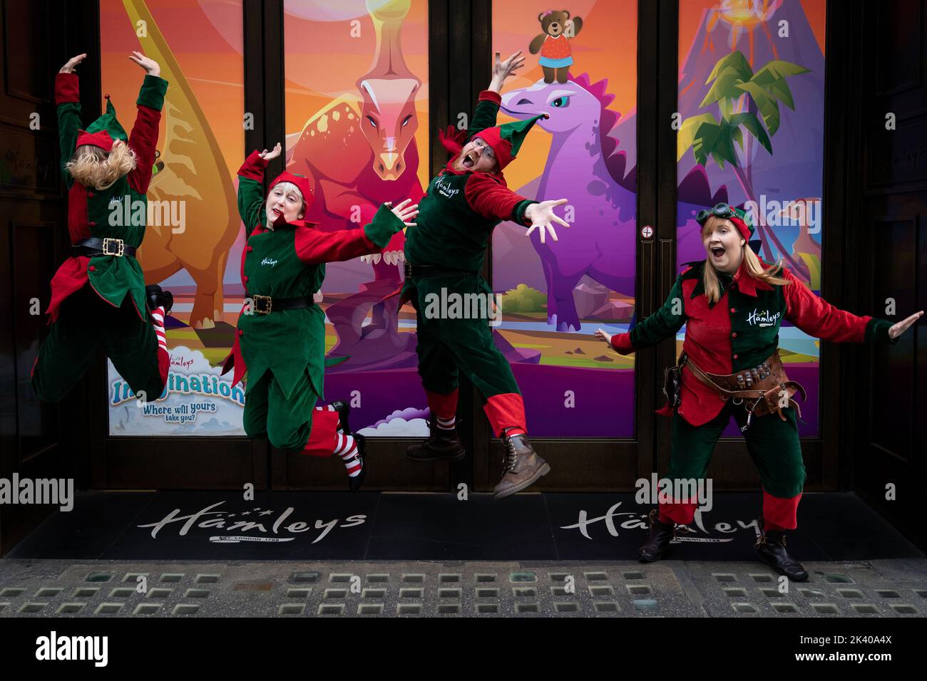 People dressed as Elves jump for joy, as they attend the Hamleys ...