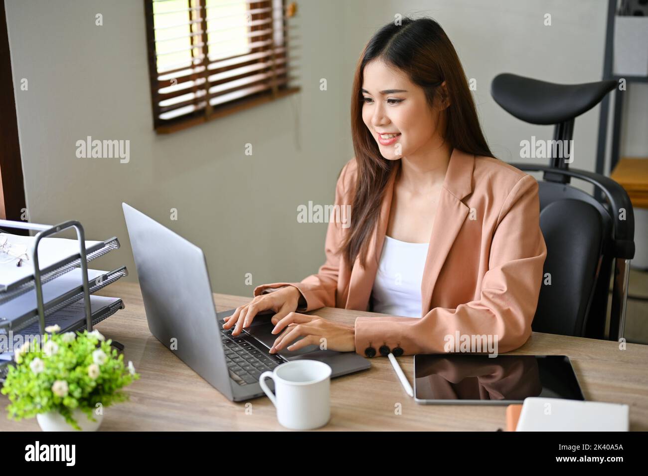 Attractive and successful millennial Asian businesswoman or female ...