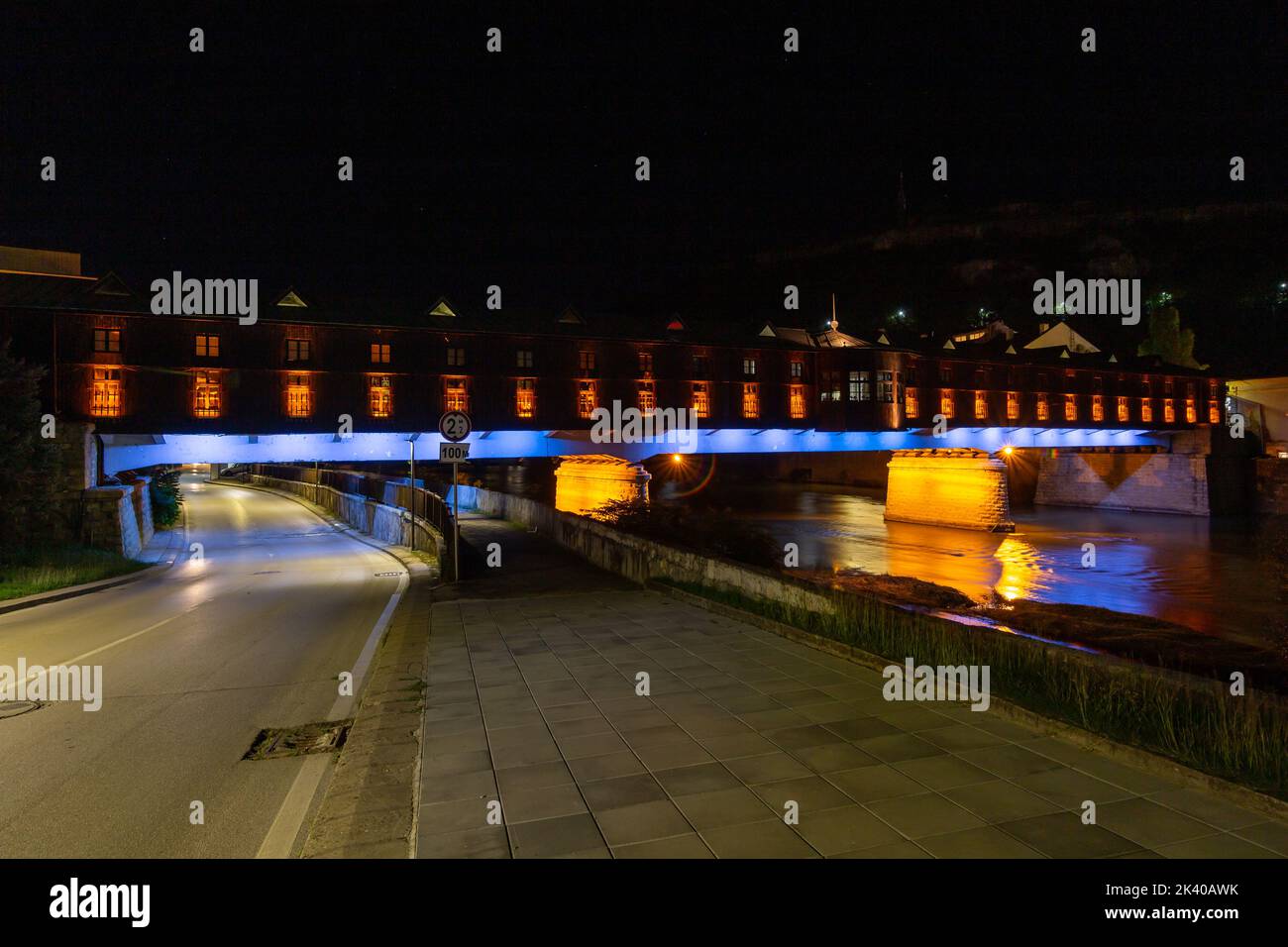 The colorful covered bridge in Lovech, Bulgaria at night. The bridge is ...