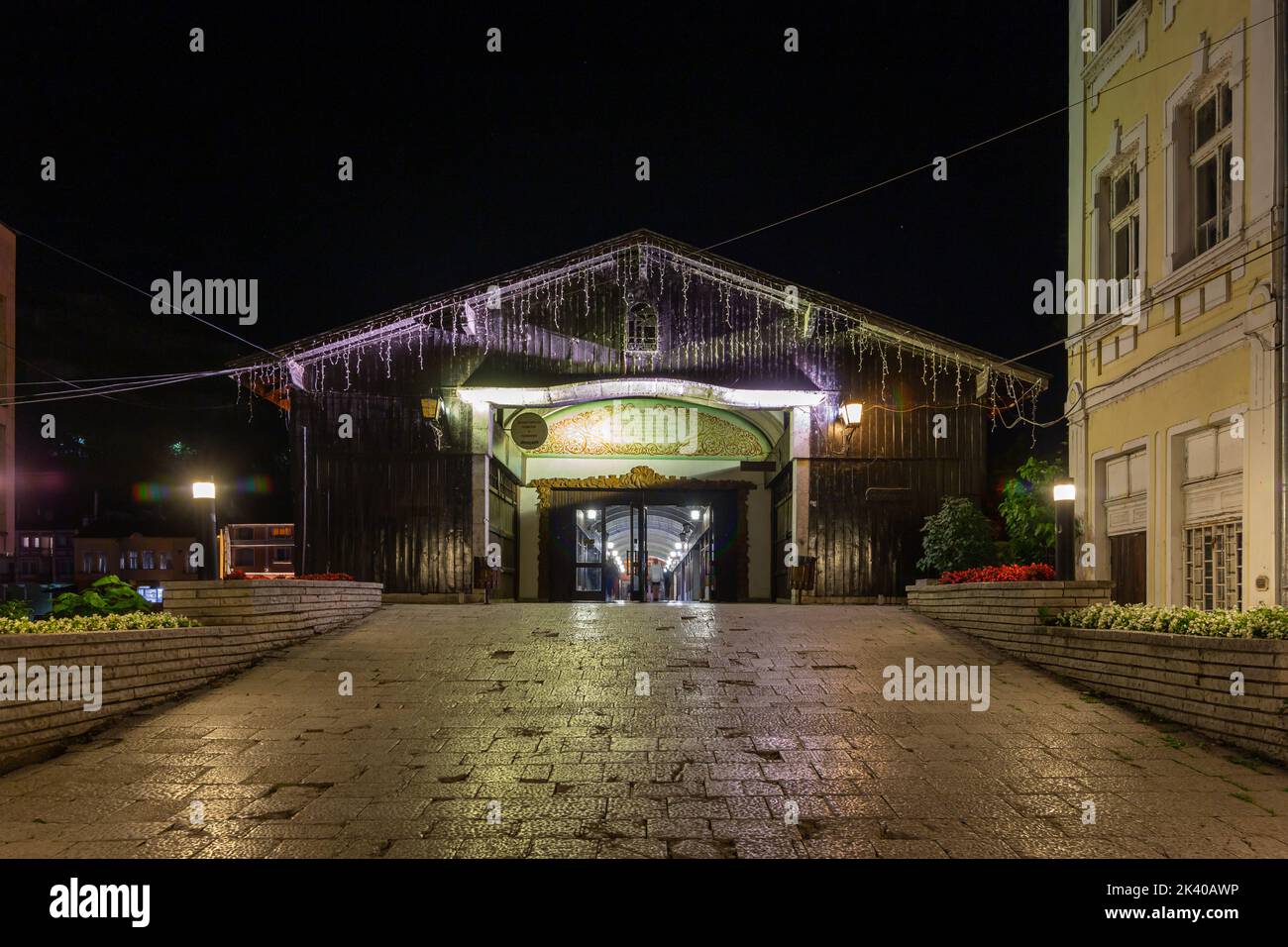 The colorful covered bridge in Lovech, Bulgaria at night. The bridge is ...