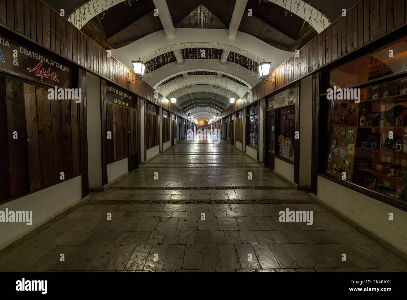 The colorful covered bridge in Lovech, Bulgaria at night. The bridge is ...