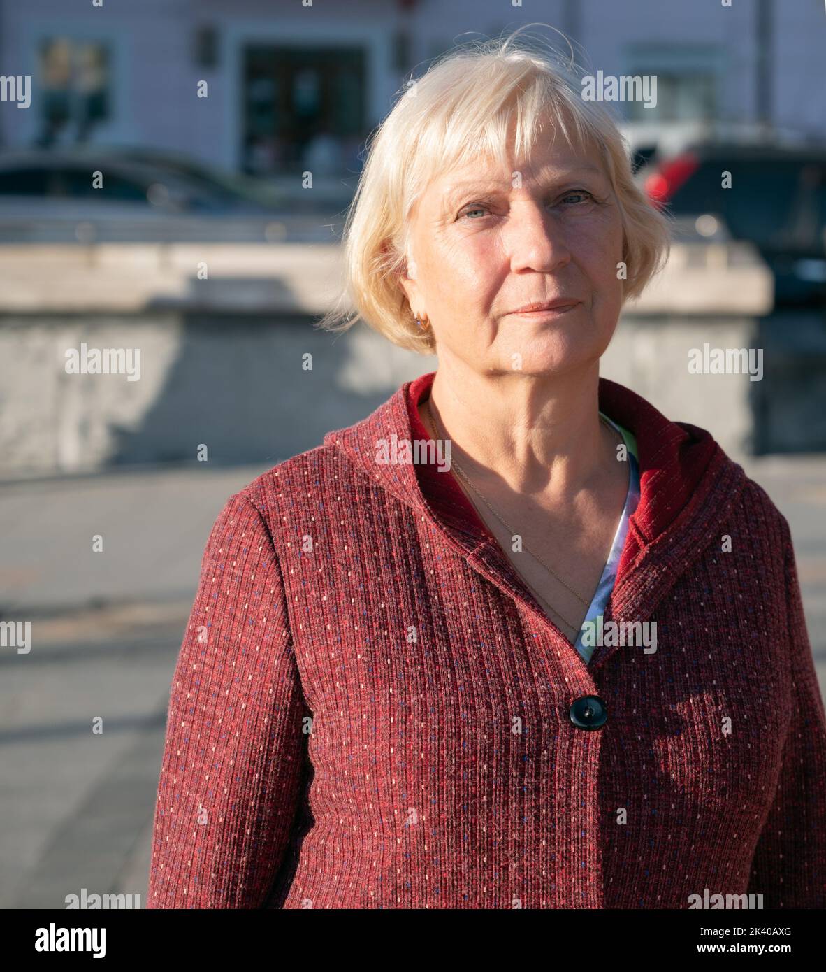 Portrait of beautiful aged woman in the street. Selective soft focus on ...