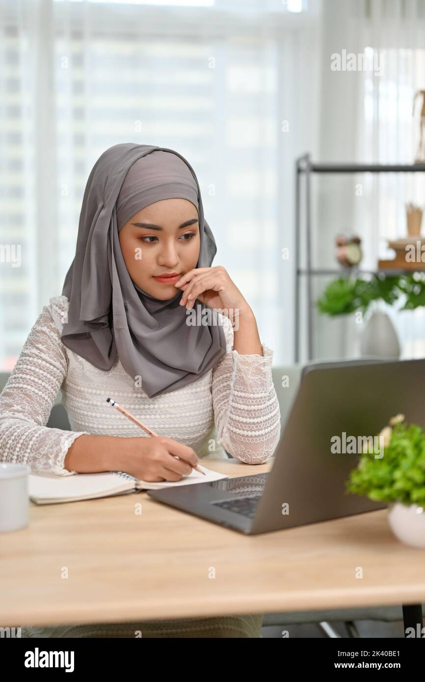 Portrait, Thoughtful young Asian Muslim female college student ...